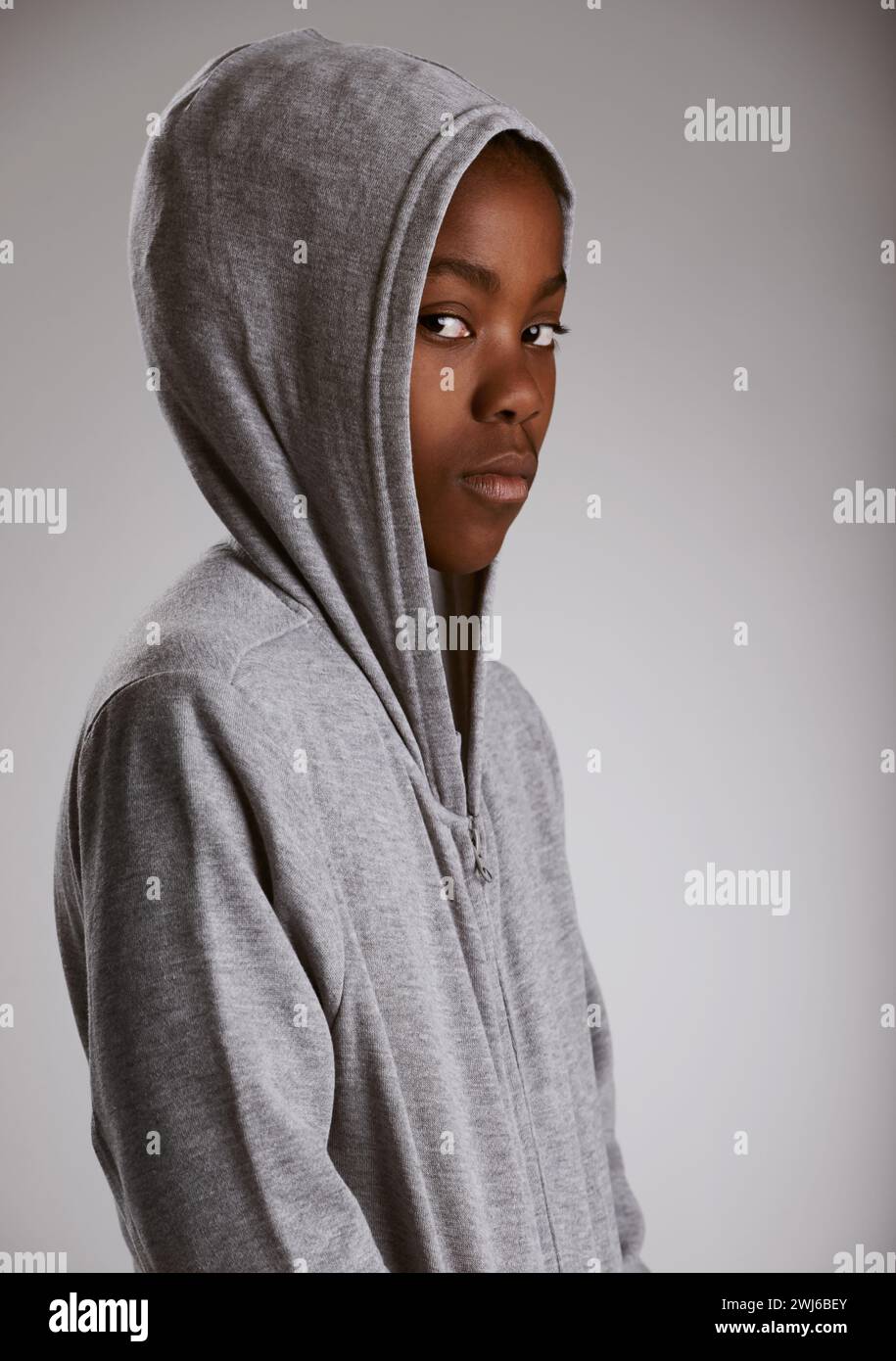 Hoodie, fashion and portrait of teenager in studio with serious kid in ...