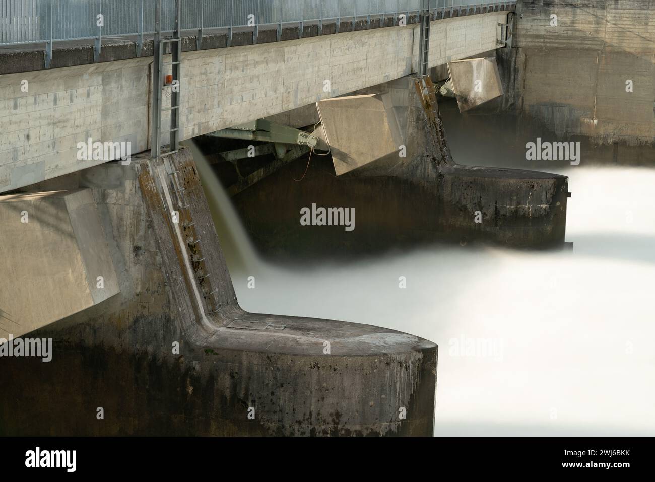 Water shooting through the weir of an electrical power plant. Smoothed ...
