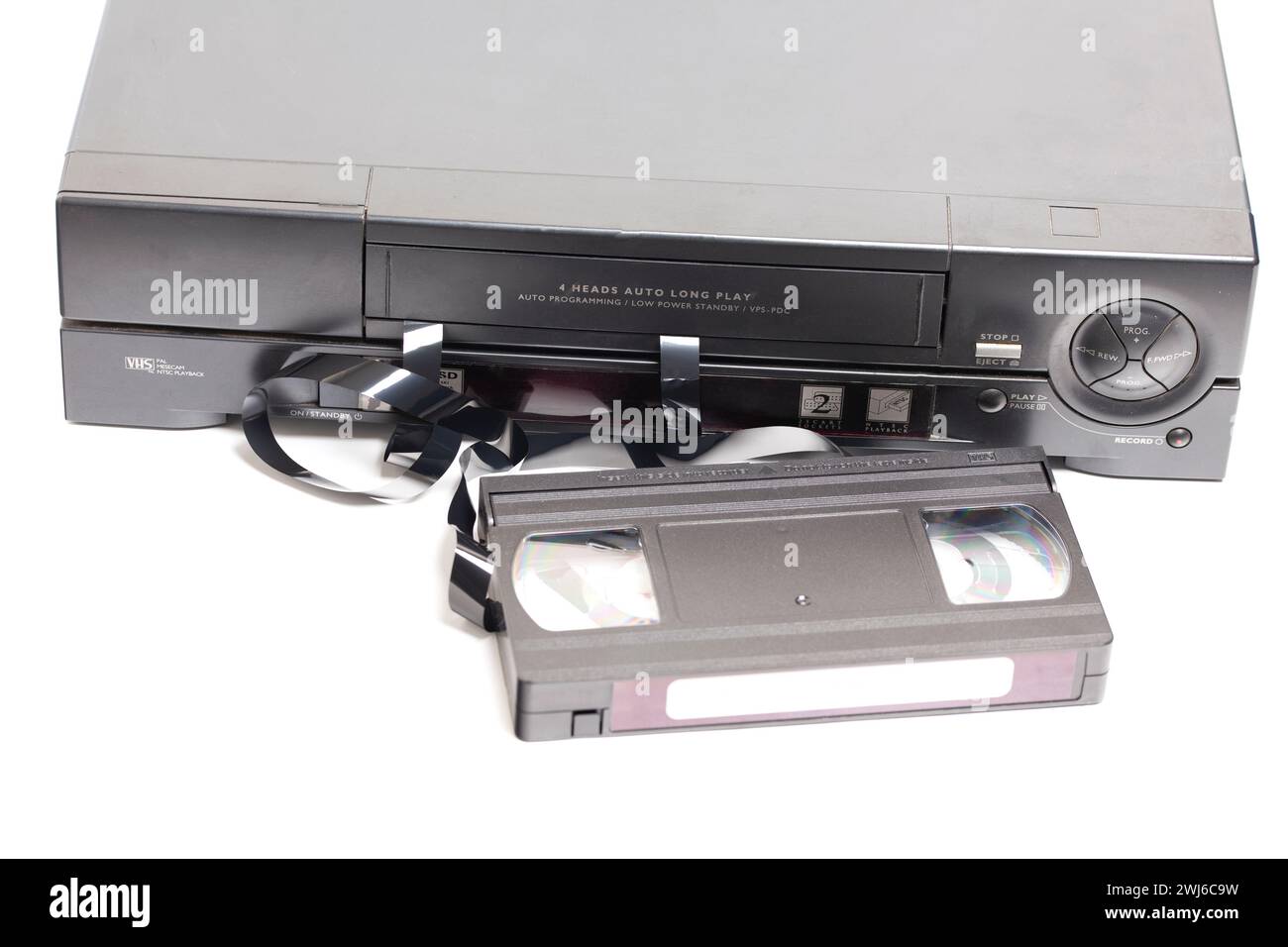 Retro video cassette recorder with VHS cassette with unwound tape ...