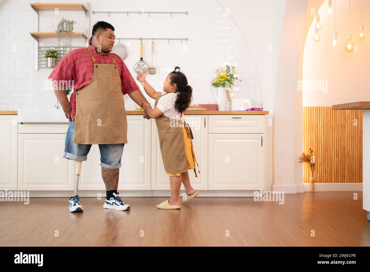 A plus size family with a father wearing a prosthetic leg, The daughter ...