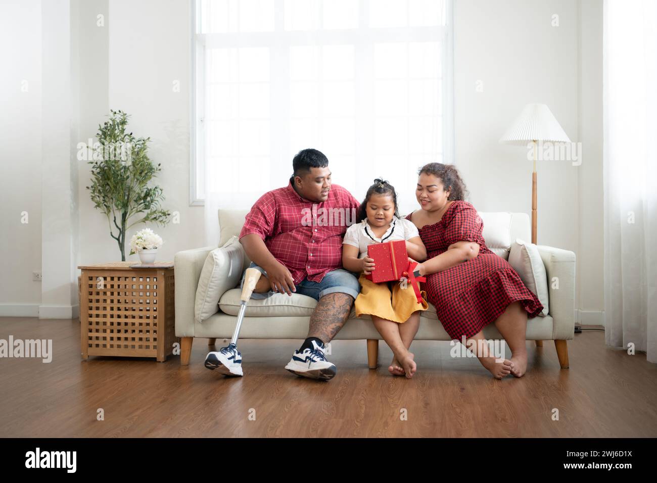 A plus size family with a father wearing a prosthetic leg, Give a gift ...