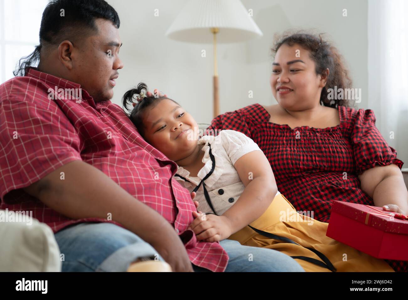 A plus size family with a father wearing a prosthetic leg, Give a gift ...