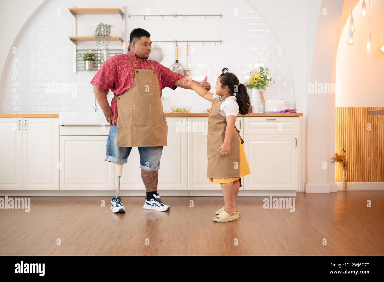 A plus size family with a father wearing a prosthetic leg, The daughter ...