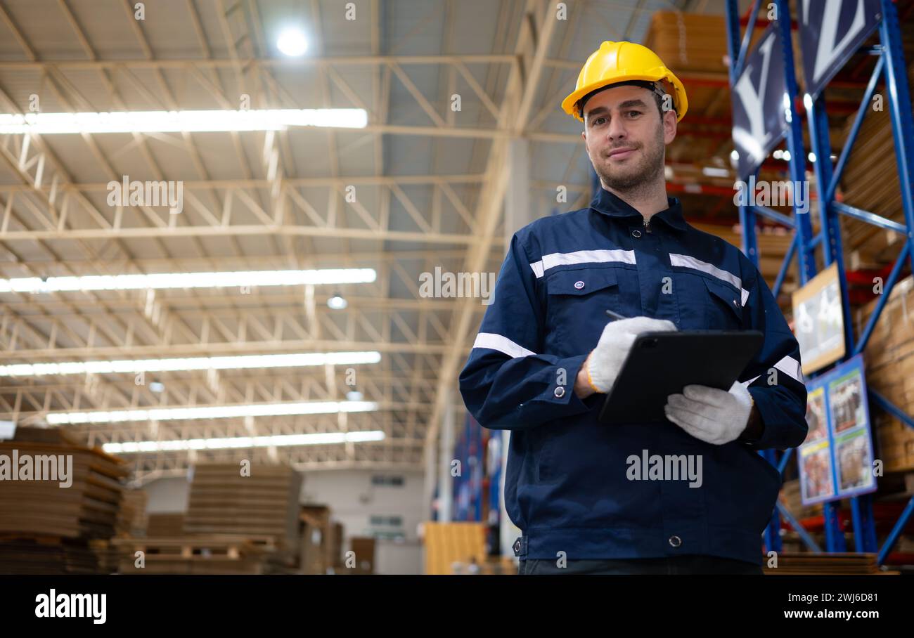 Portrait of confident male warehouse worker with digital tablet in ...