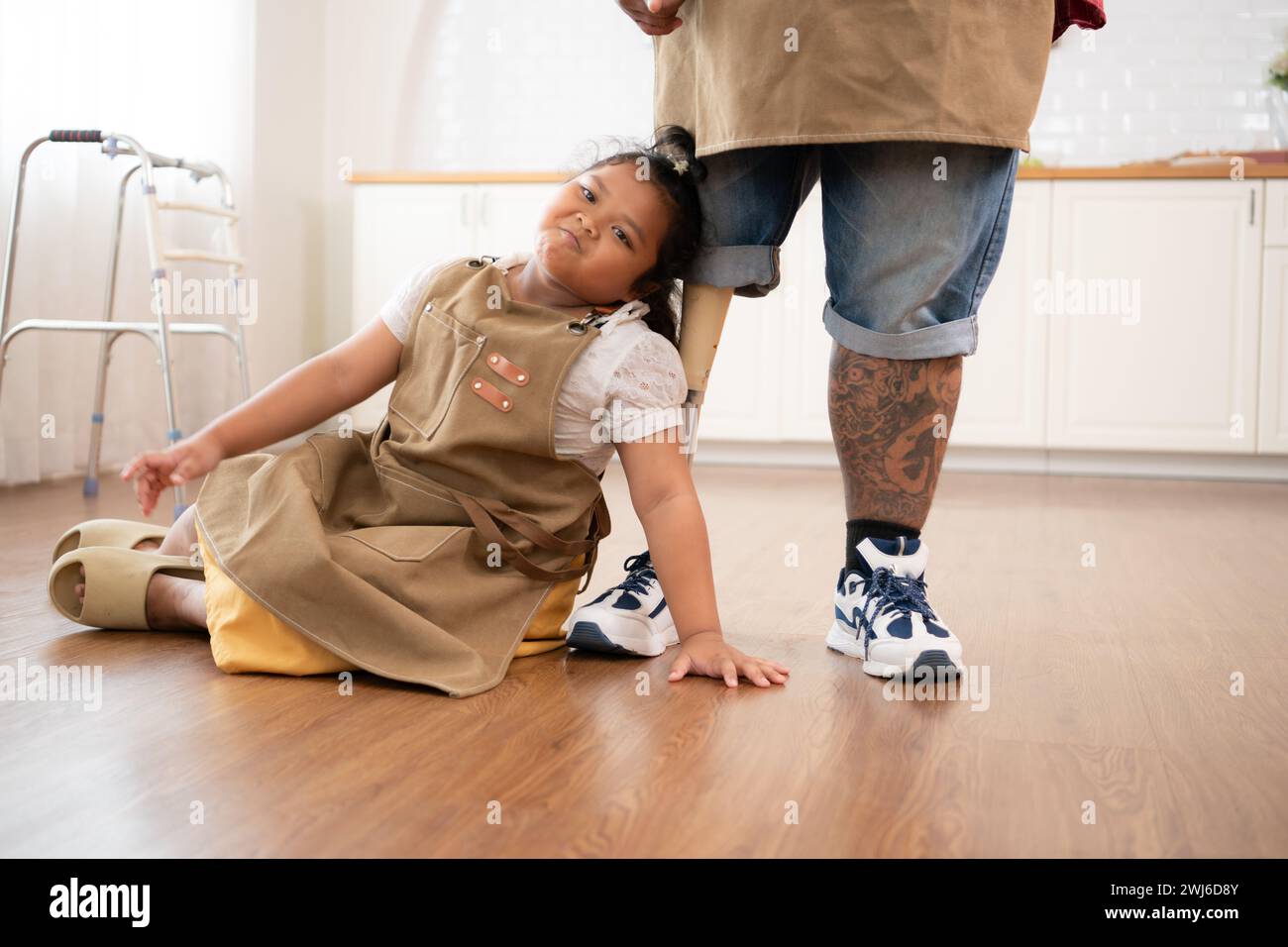 A plus size family with a father wearing a prosthetic leg, The daughter ...