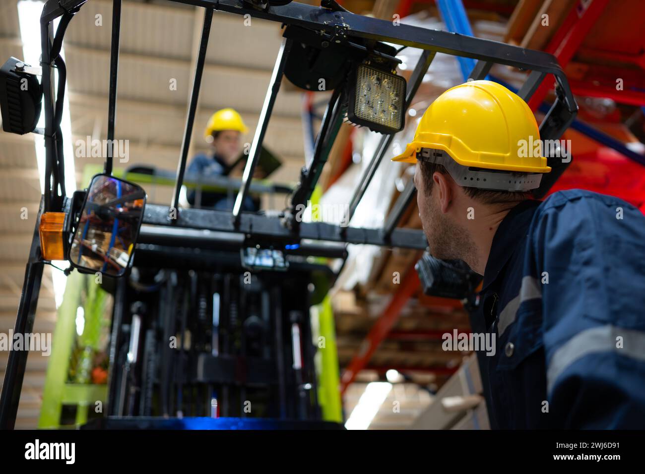 Warehouse workers using forklift to check and counting in a large ...