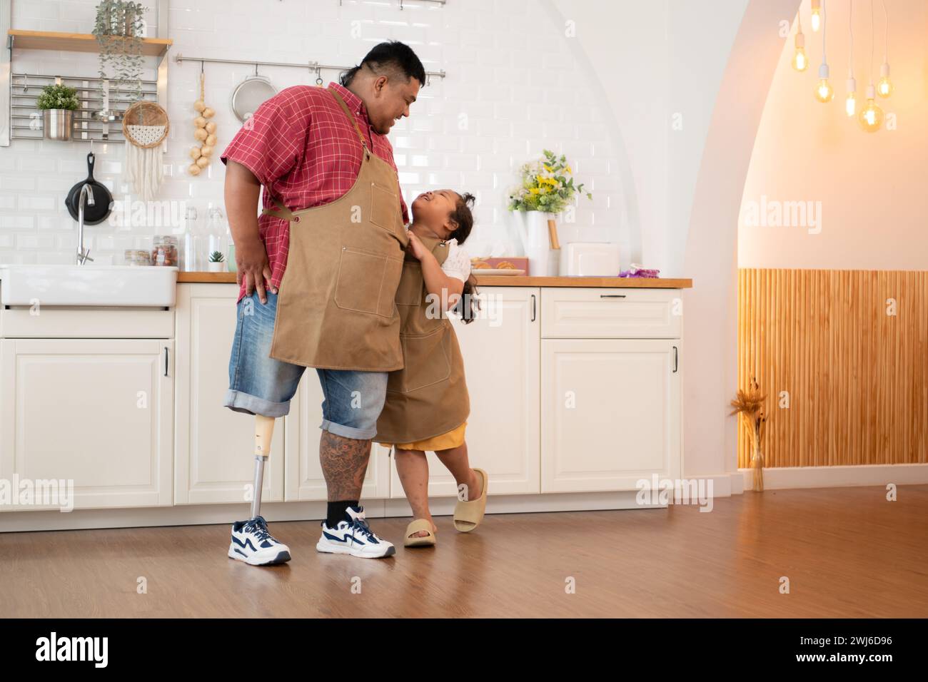 A plus size family with a father wearing a prosthetic leg, The daughter ...