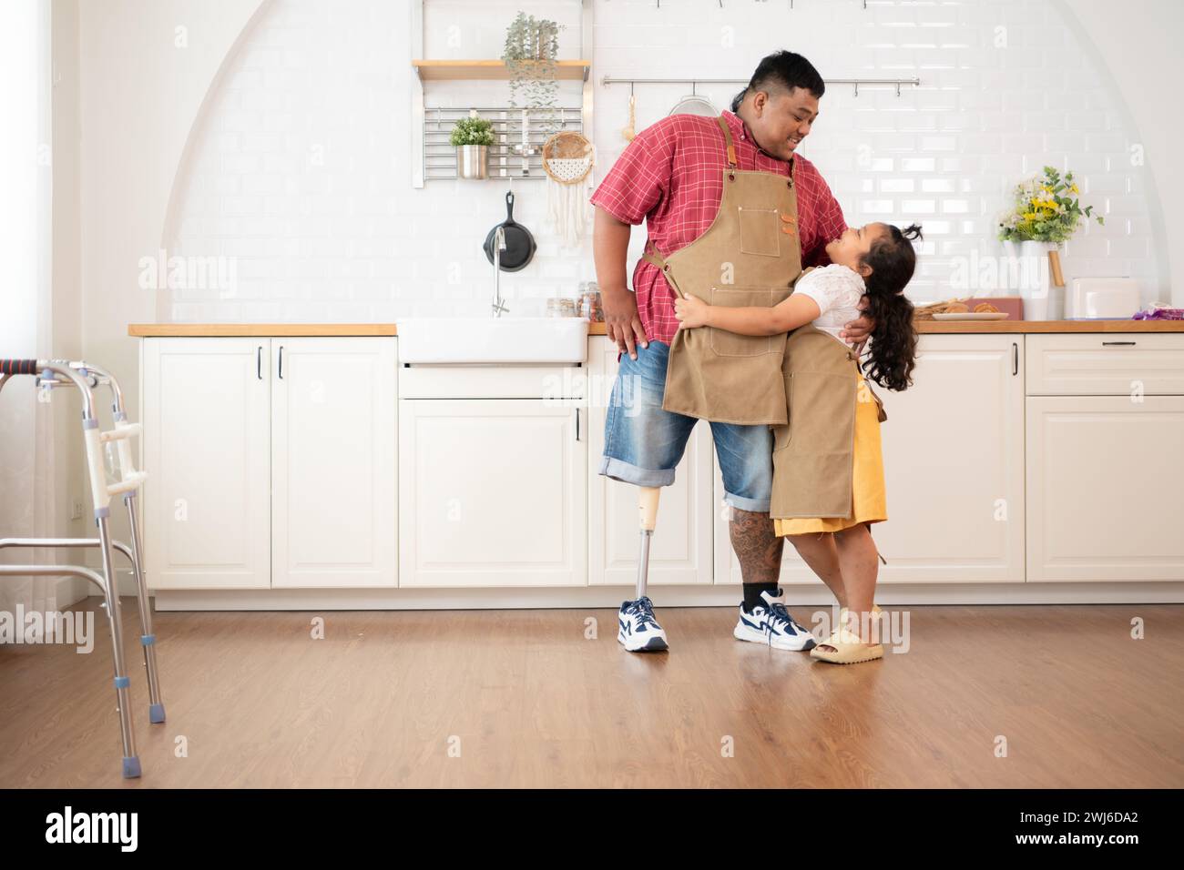 A plus size family with a father wearing a prosthetic leg, The daughter ...