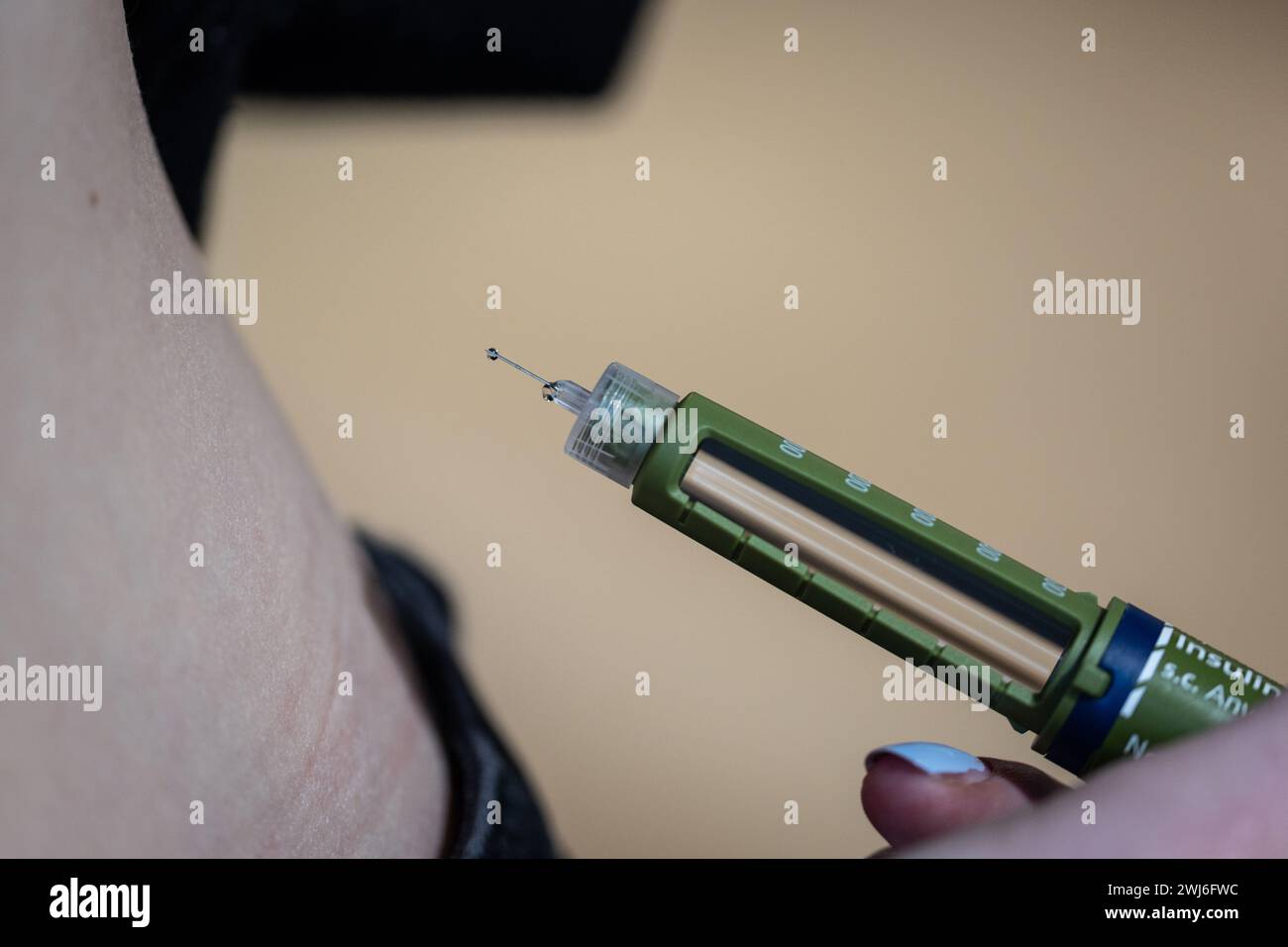 Berlin, Germany. 13th Feb, 2024. A drop of insulin hangs from the ...