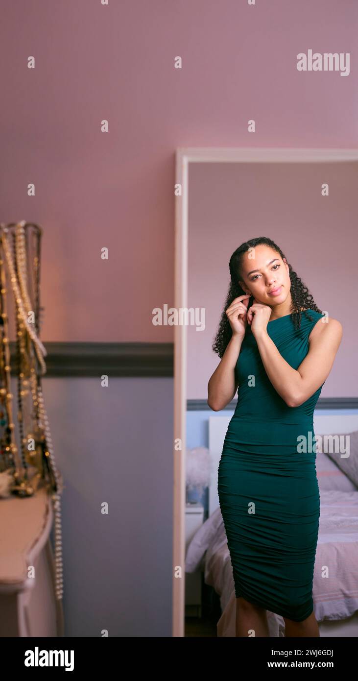 Teenage Girl At Home In Bedroom Getting Ready For Prom Or Night Out ...