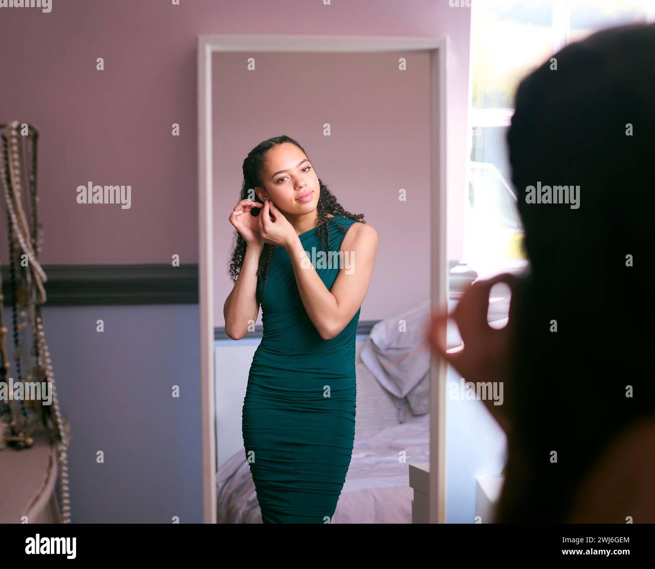 Teenage Girl At Home In Bedroom Getting Ready For Prom Or Night Out ...