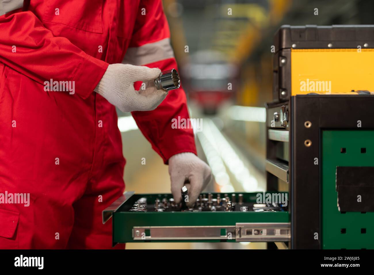 Picture of engineer using repair tools of the electric train industry ...