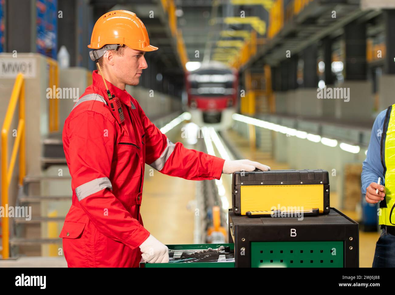 Portrait of engineer using repair tools of the electric train industry ...