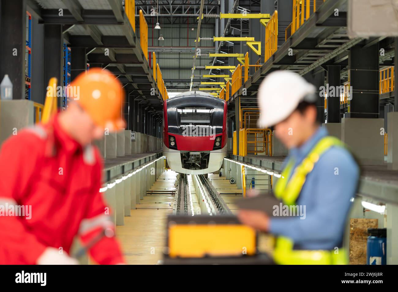 Electric train engineer and technician using repair tools of the ...