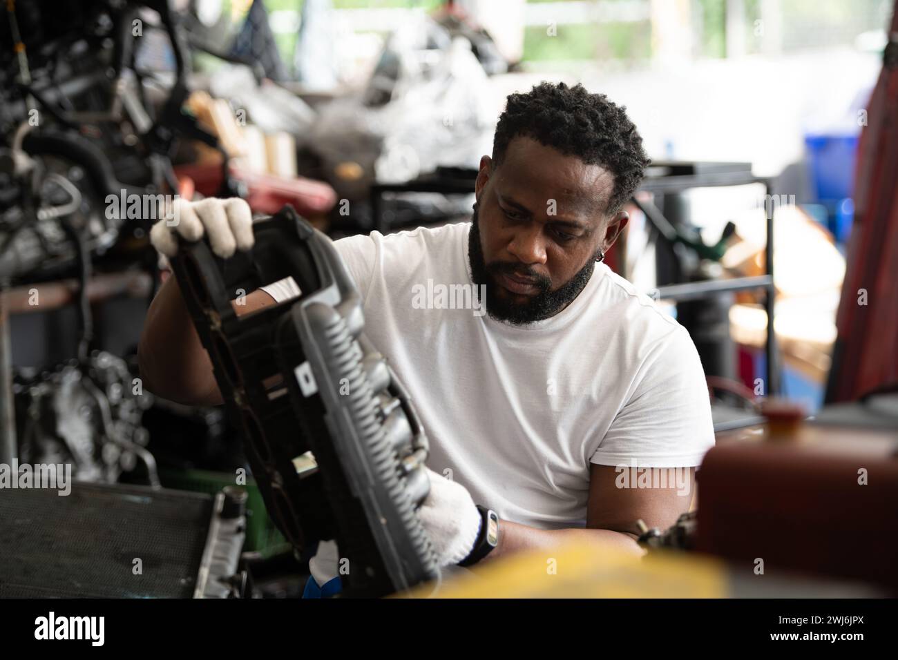 Men repairing car engine in auto repair shop, Selective focus Stock ...