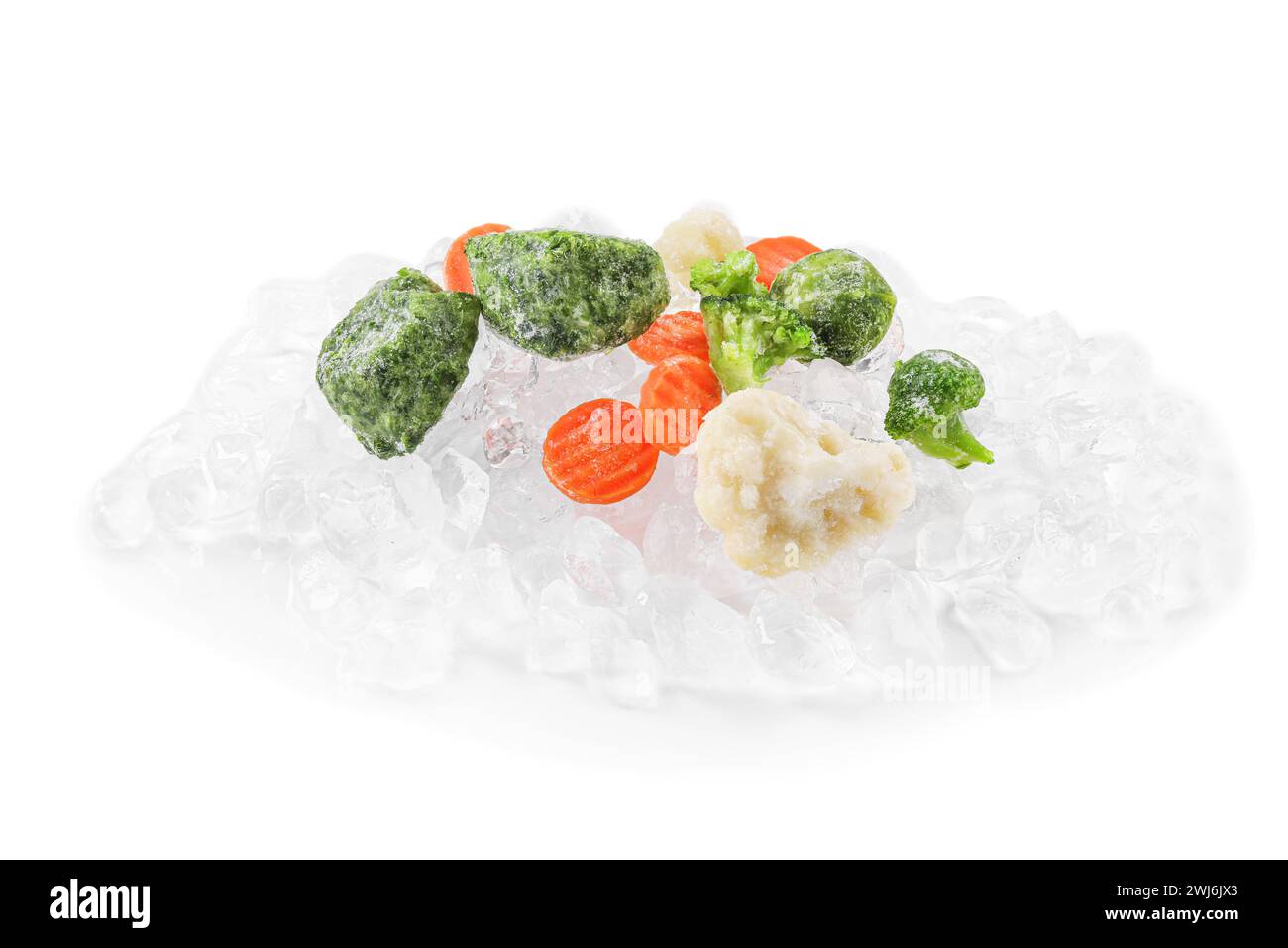 Mix of different frozen vegetables with ice isolated on white Stock ...
