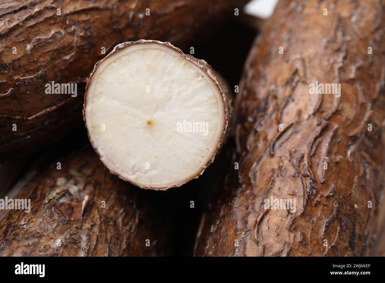 Whole and cut cassava roots as background, closeup Stock Photo - Alamy