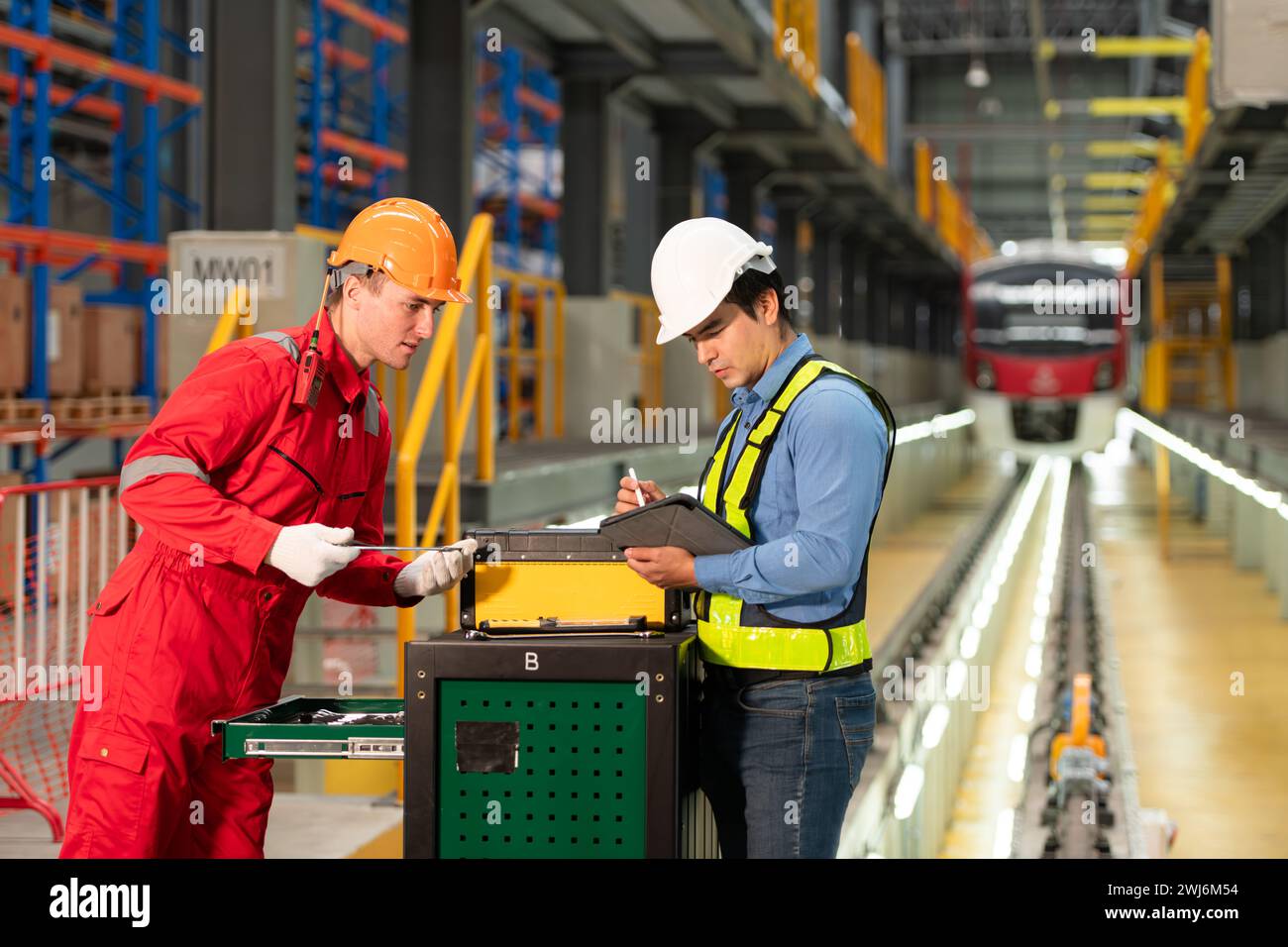 Electric train engineer and technician using repair tools of the ...