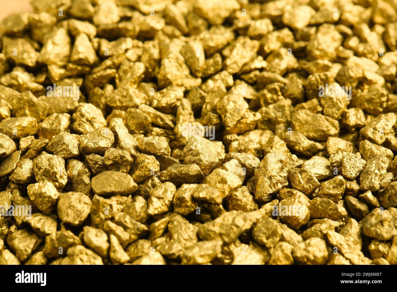 Many shiny gold nuggets as background, closeup Stock Photo - Alamy