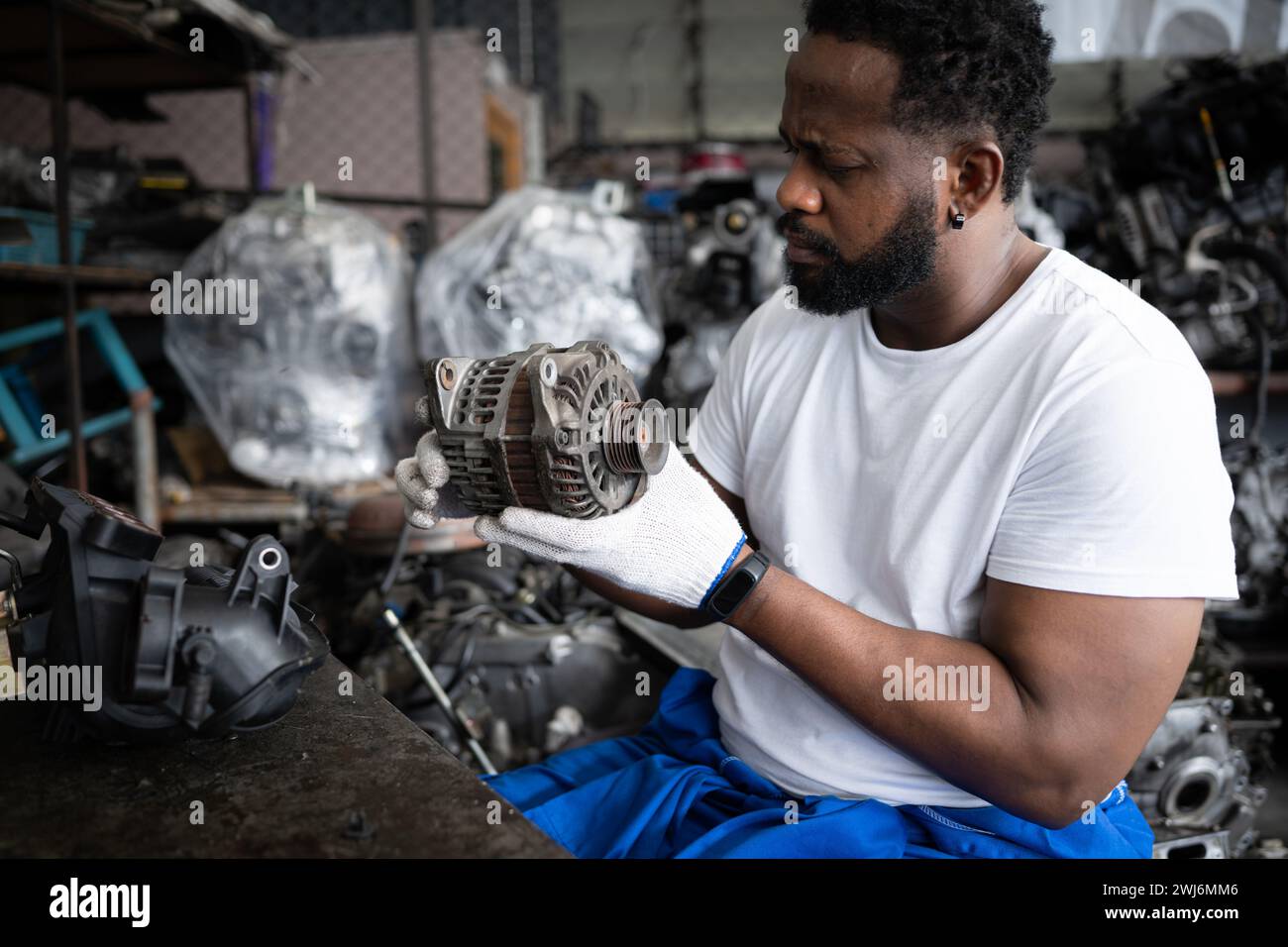 Men repairing car engine in auto repair shop, Selective focus Stock ...