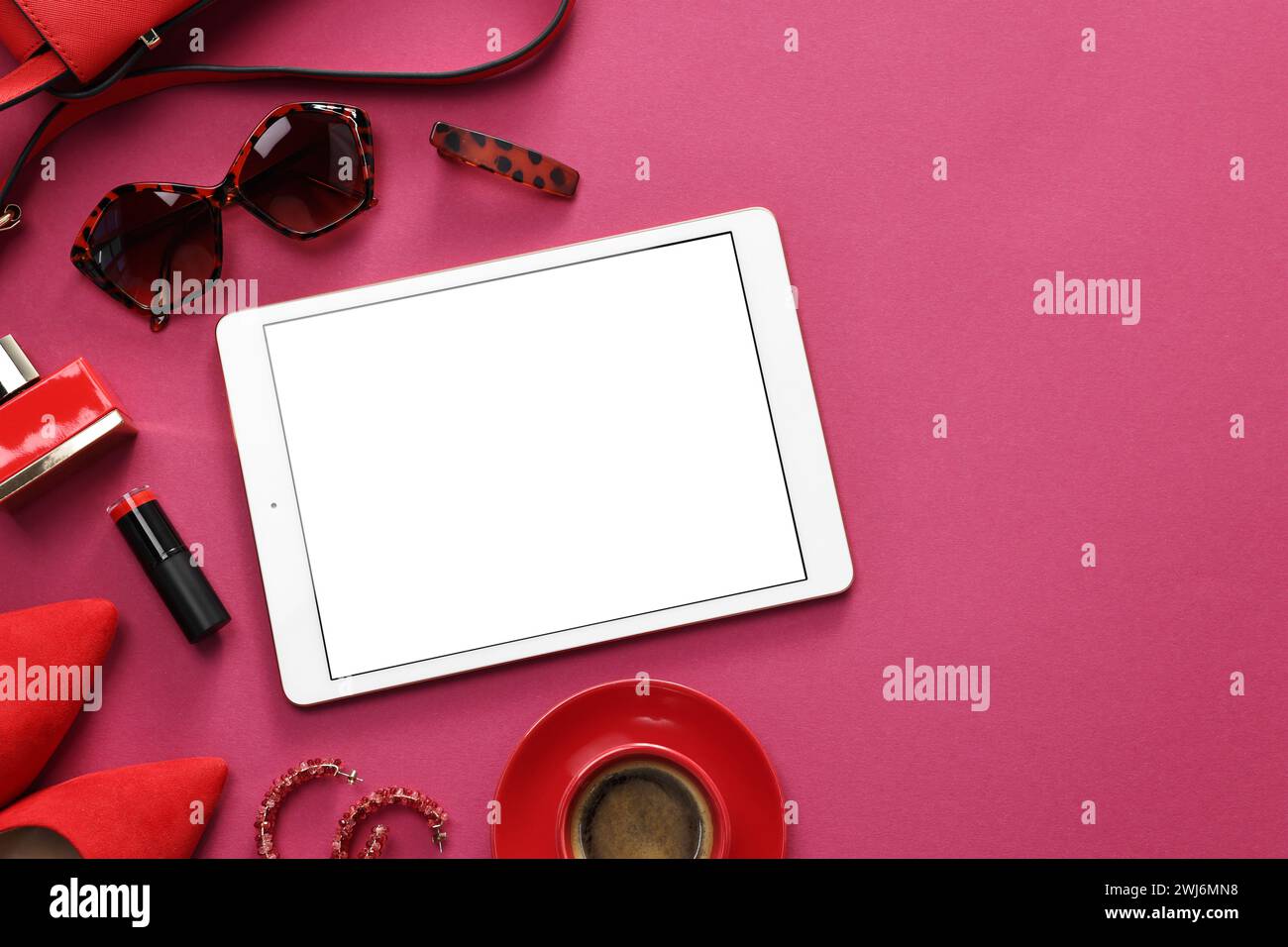 Flat lay composition with modern tablet on hot pink background. Space ...