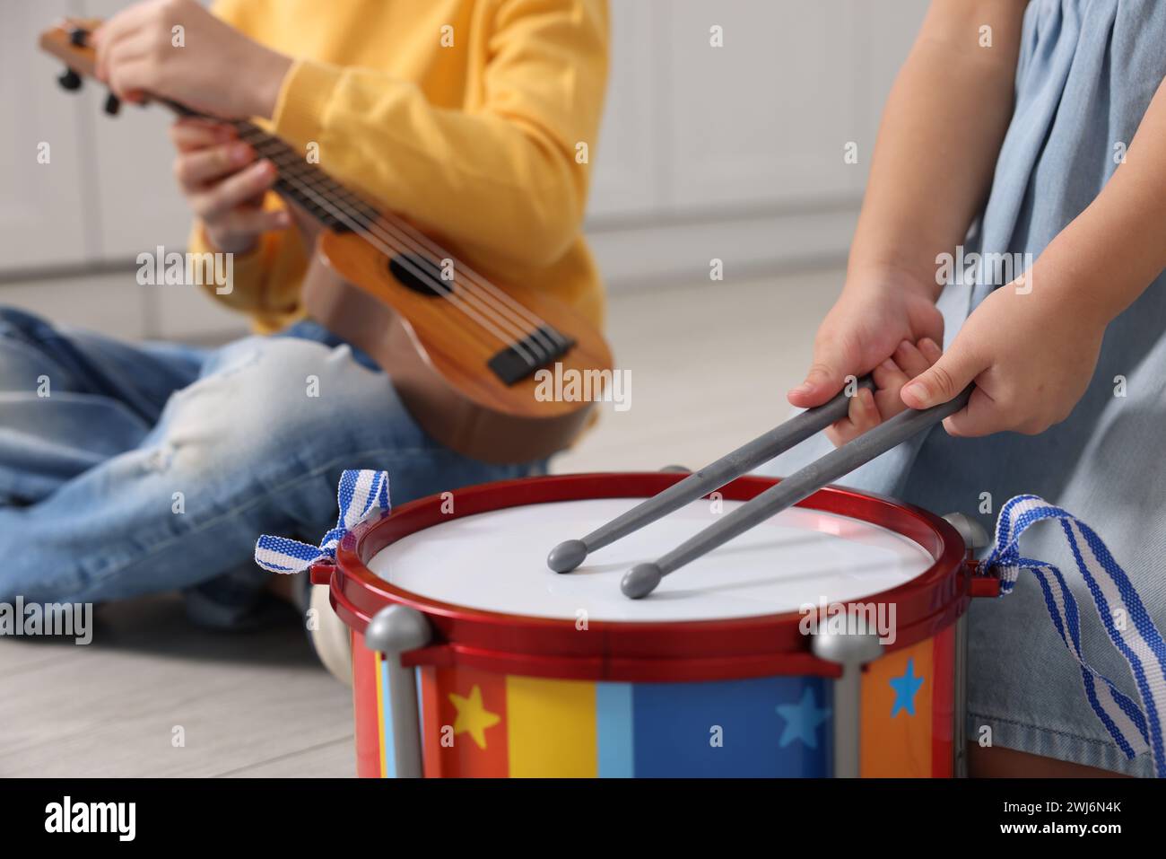 Little children playing toy musical instruments indoors, closeup Stock ...