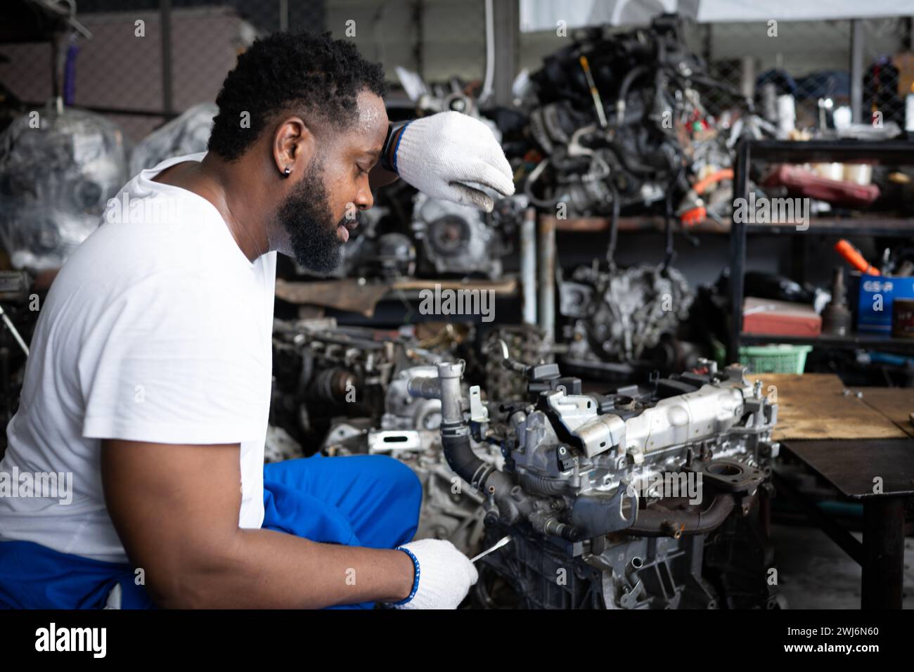 Men repairing car engine in auto repair shop, Selective focus Stock ...