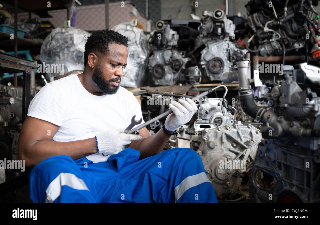 Men repairing car engine in auto repair shop, Selective focus Stock ...