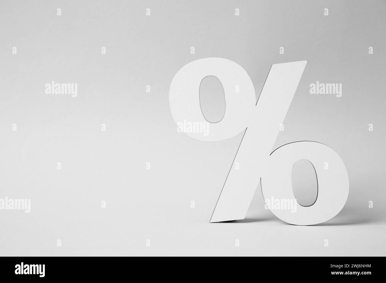 White percent sign on light grey background. Space for text Stock Photo ...