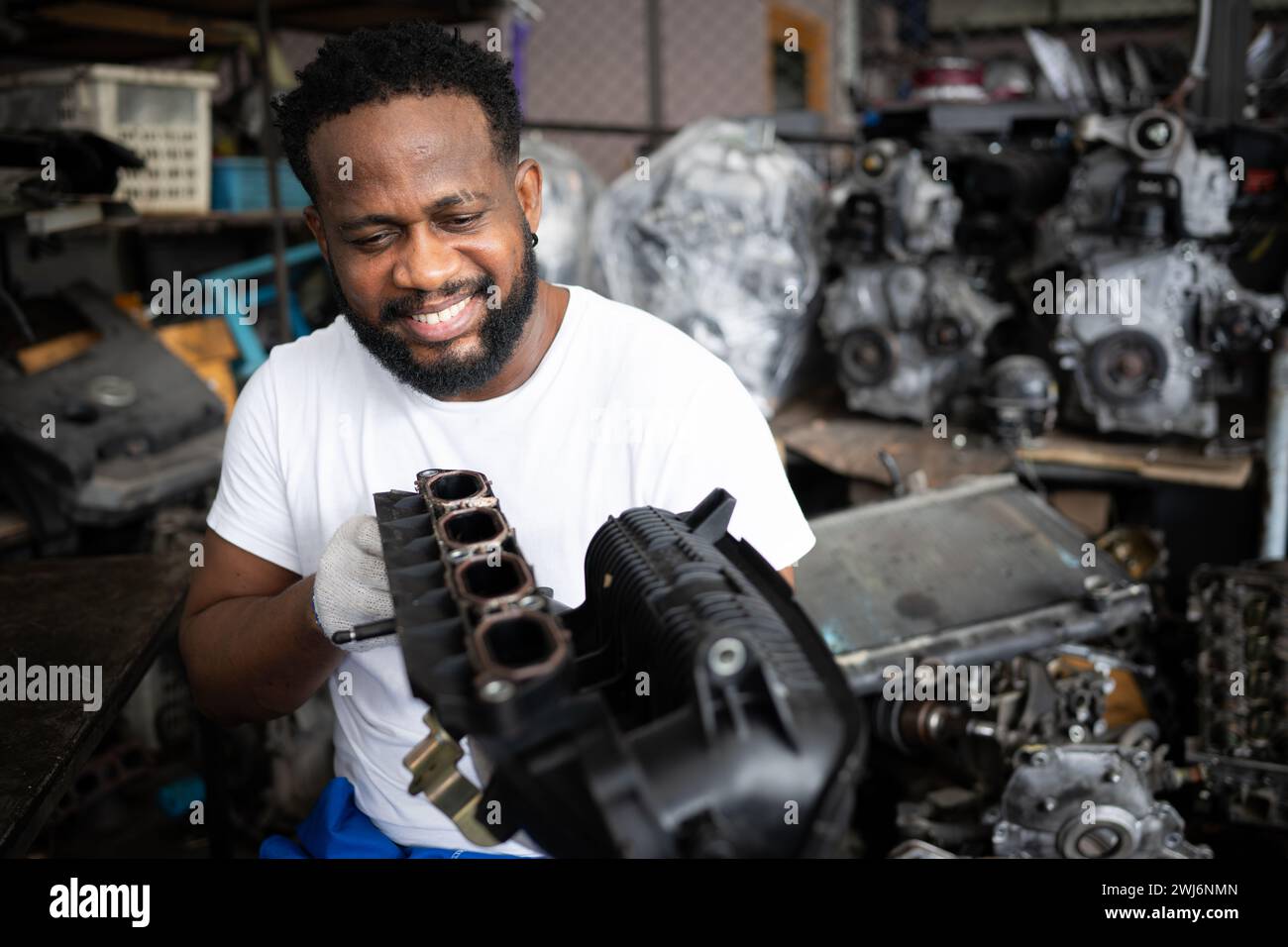 Men repairing car engine in auto repair shop, Selective focus Stock ...