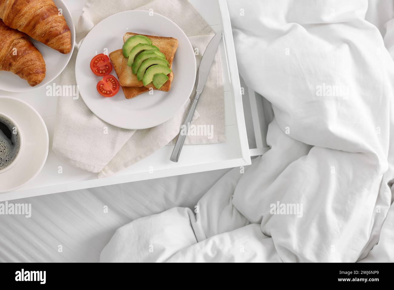 Good morning. Tray with tasty breakfast on bed, top view Stock Photo ...