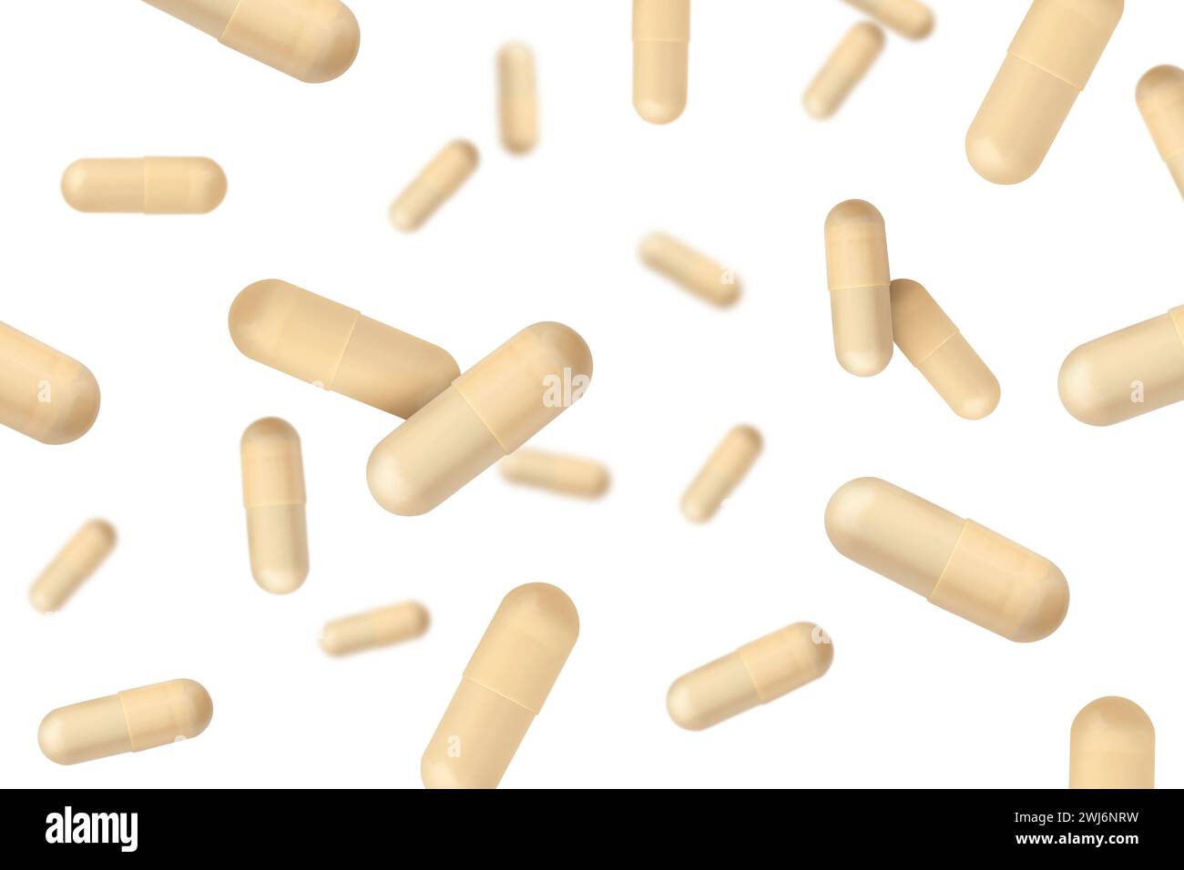 Vitamin. Many capsules falling on white background Stock Photo - Alamy