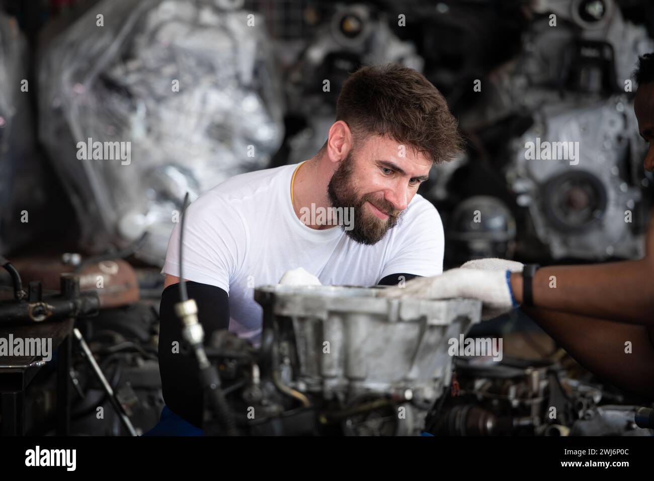 Men repairing car engine in auto repair shop, Selective focus Stock ...