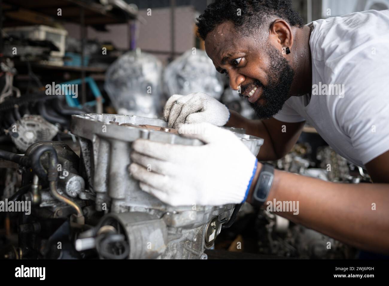 Men repairing car engine in auto repair shop, Selective focus Stock ...