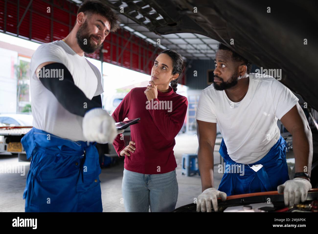 Mechanic man examining maintenance customer hi-res stock photography ...