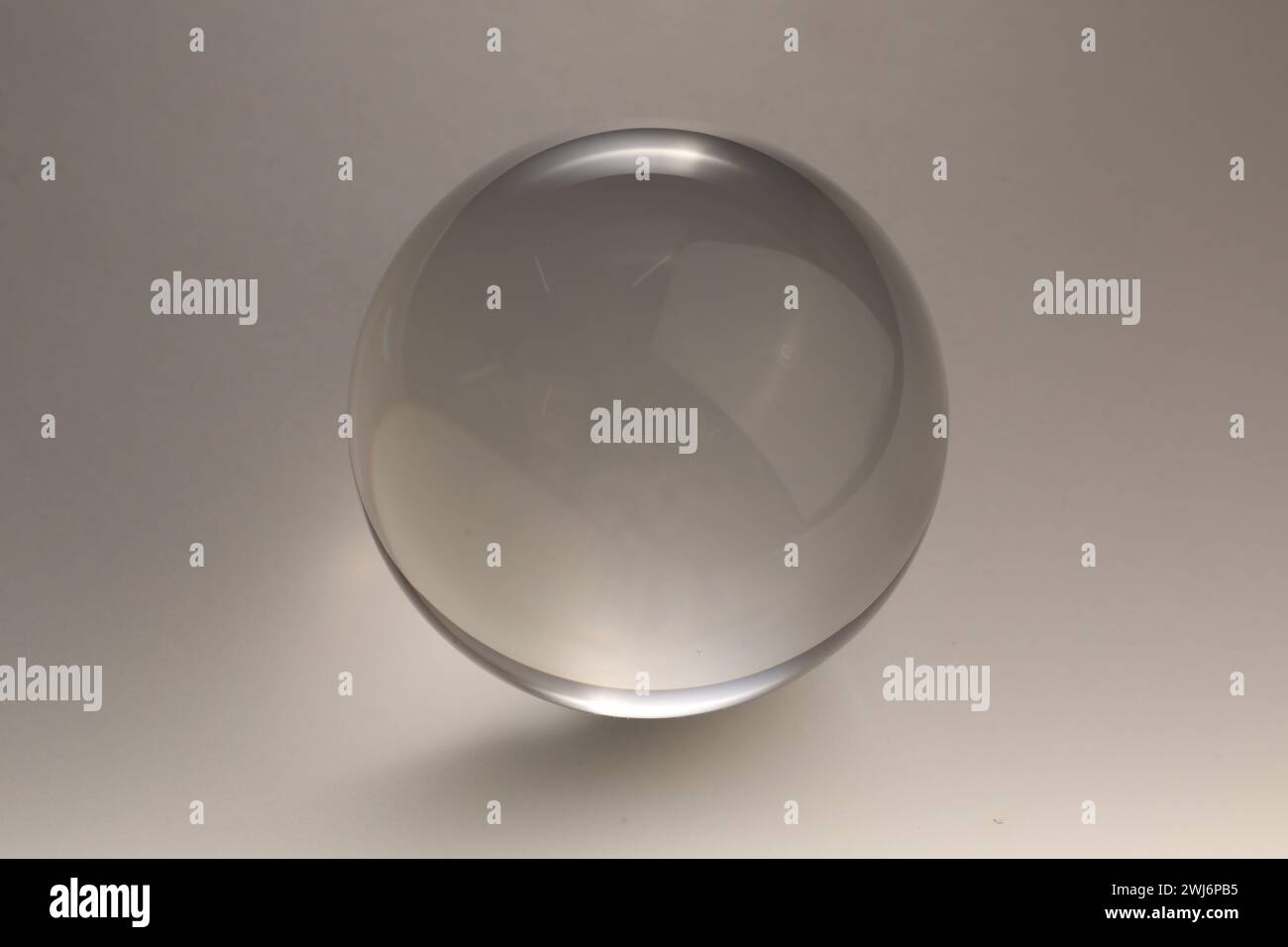 Transparent glass ball on light grey background Stock Photo - Alamy