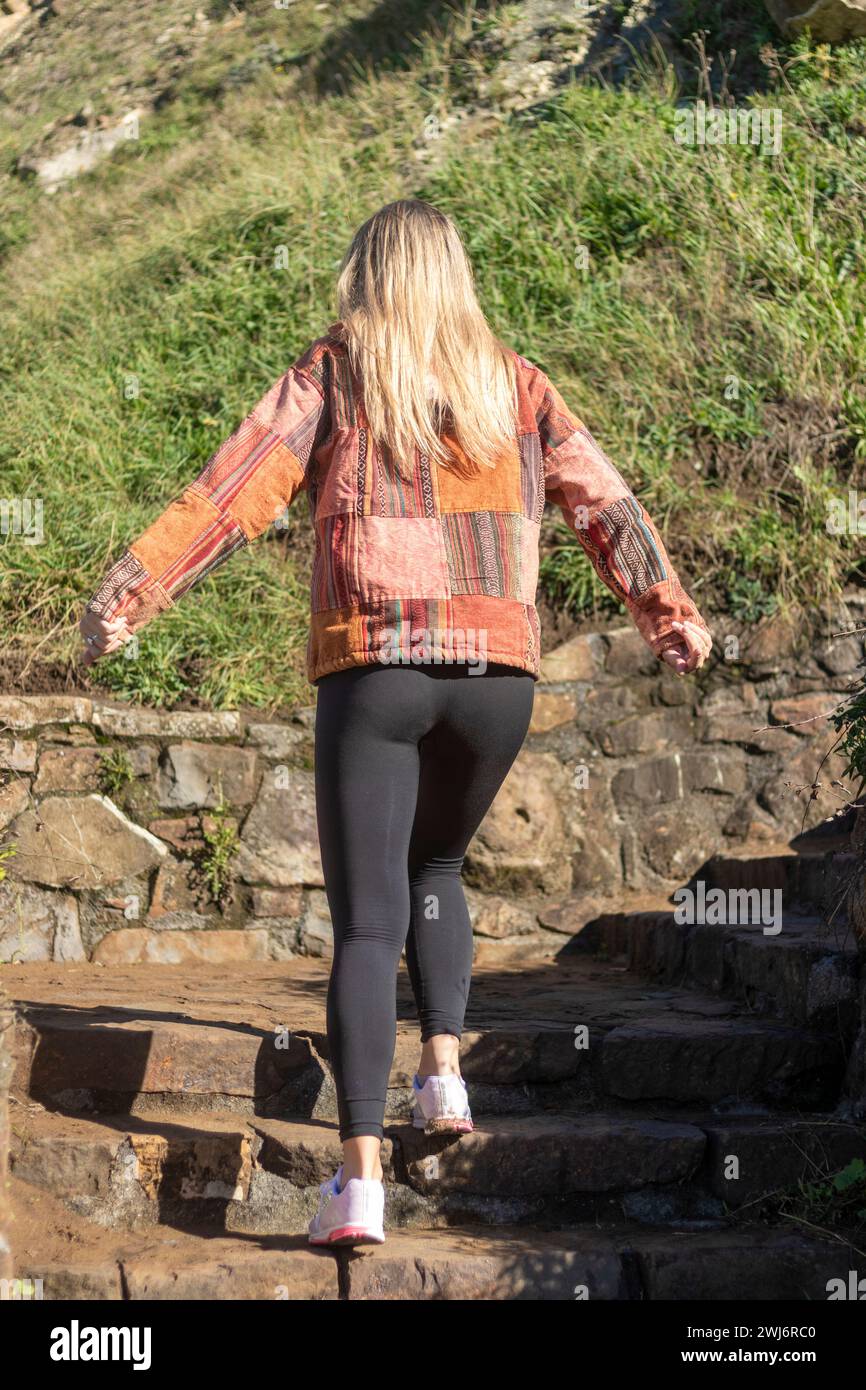 Woman wearing pants walking hi-res stock photography and images - Alamy