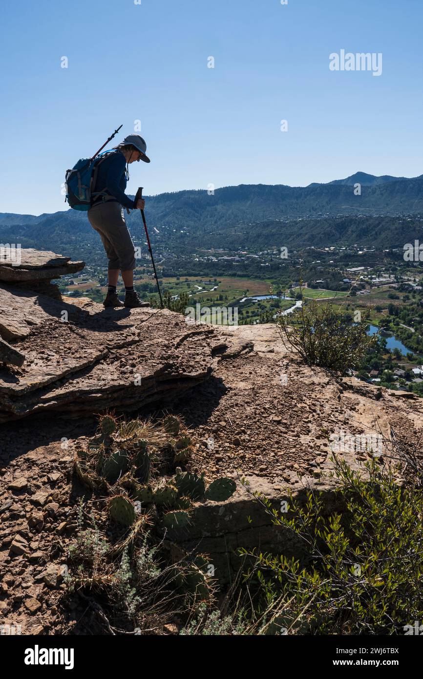 WOMAN HIKER WALKING ON LEDGE ABOVE DURANGO, COLORADO, USA Stock Photo ...