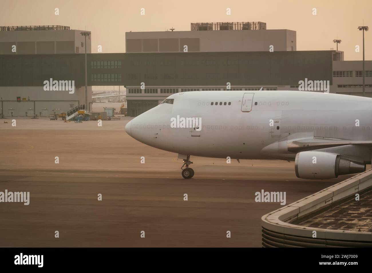 Cargo plane double decker fuselage without windows taxiing along the ...