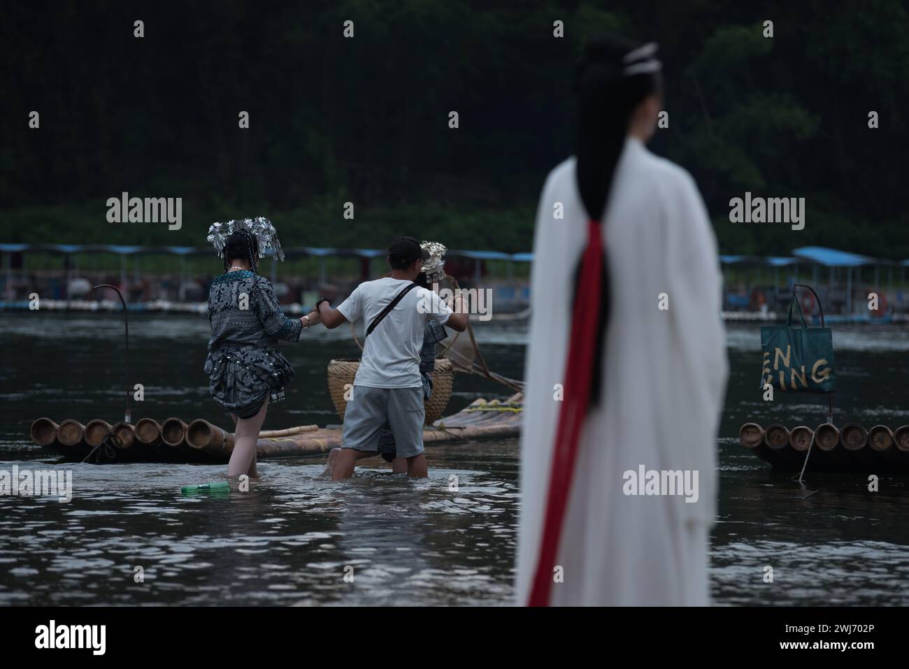 Along the Li River, photographers provide photography services to ...