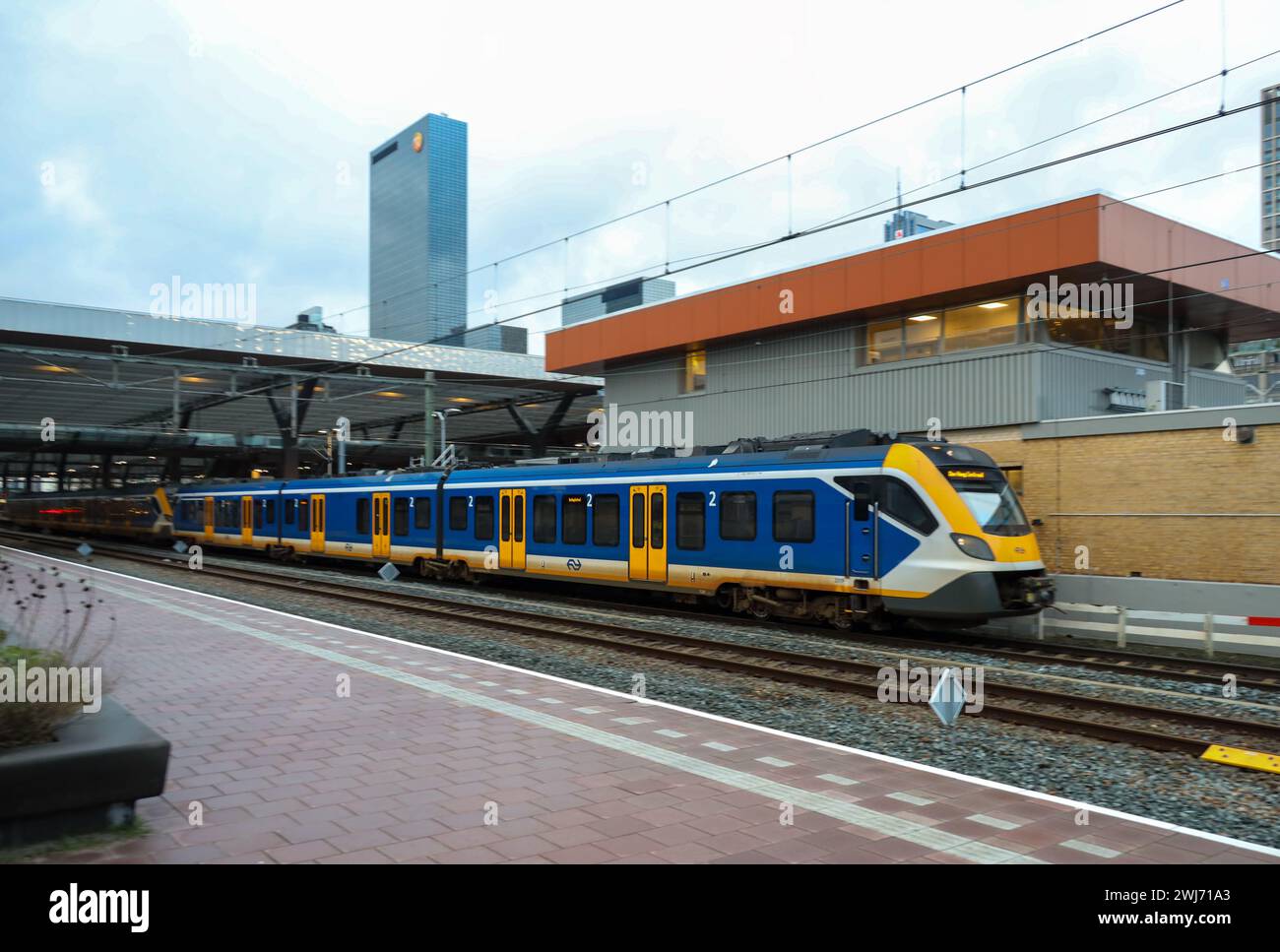 SNG local sprinter train along platform at Rotterdam Central station ...