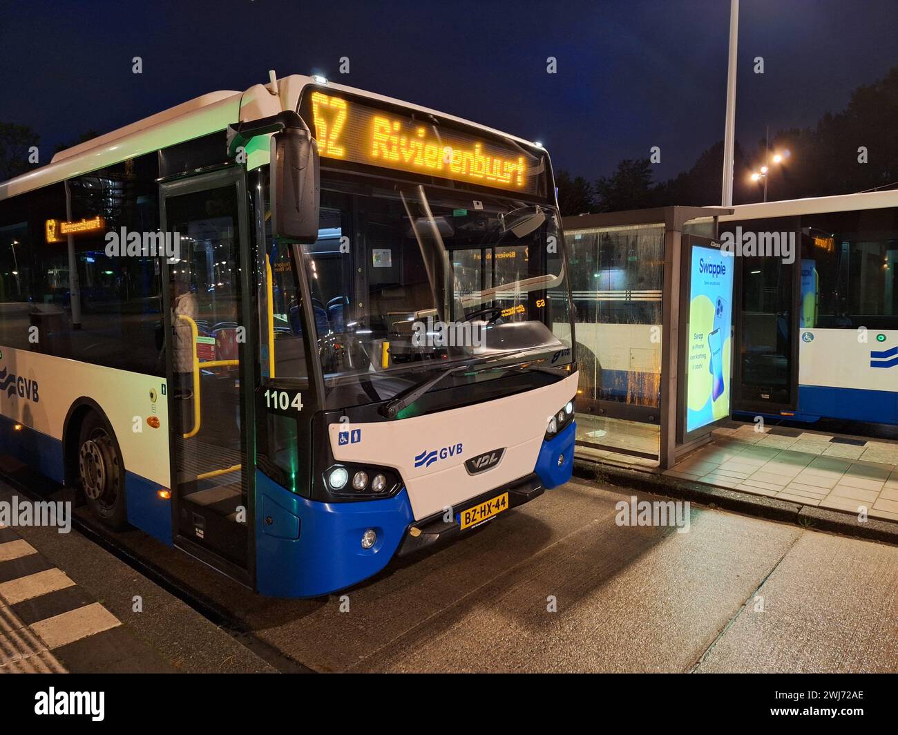 Blue and white GVB city bus at station Amsterdam Lelylaan in the ...