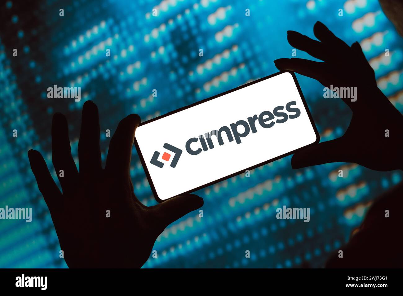 In this photo illustration, the Cimpress logo is displayed on a smartphone screen Stock Photo ...