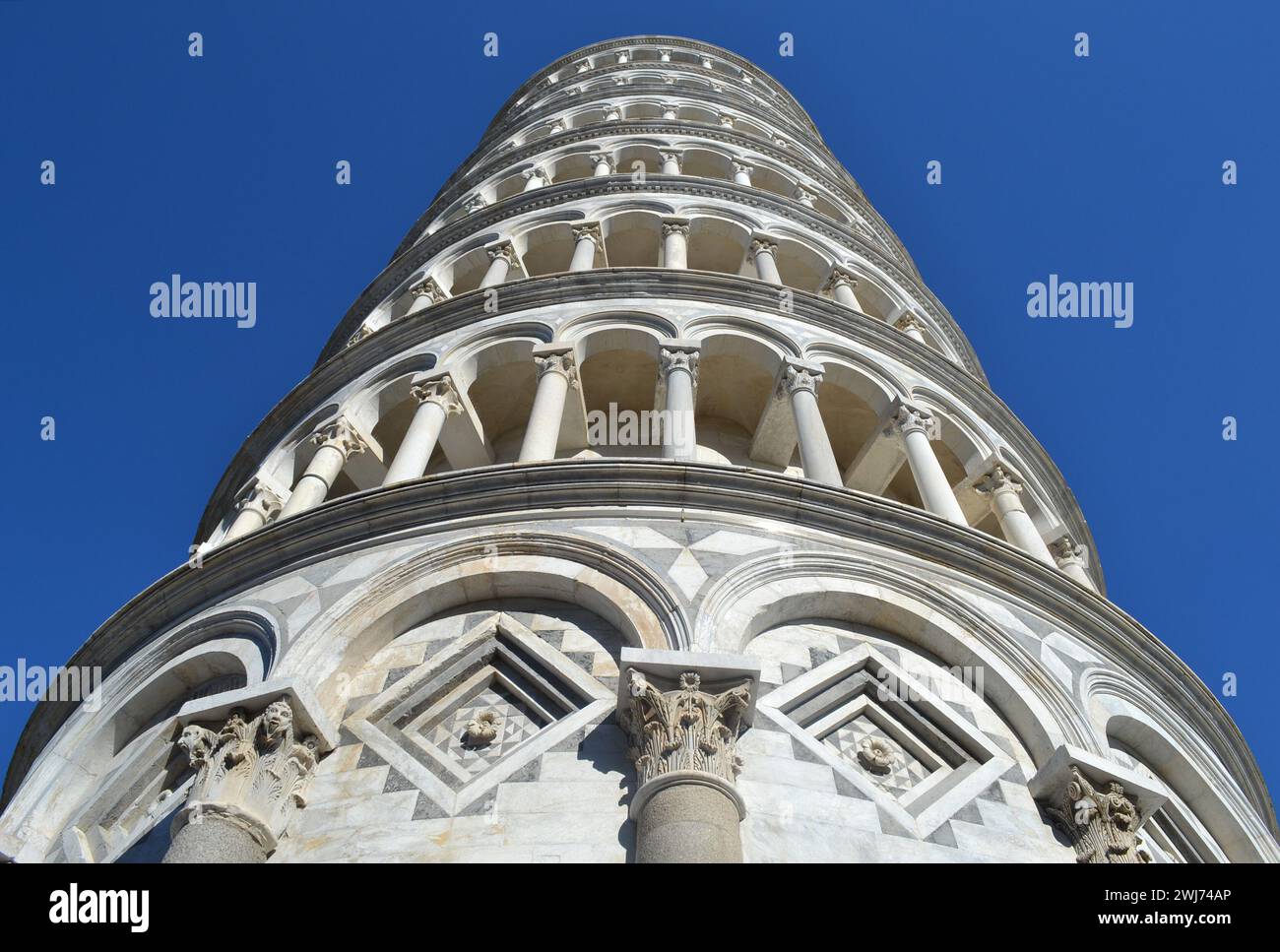 View of the Leaning Tower of Pisa from below. It is known for being a ...