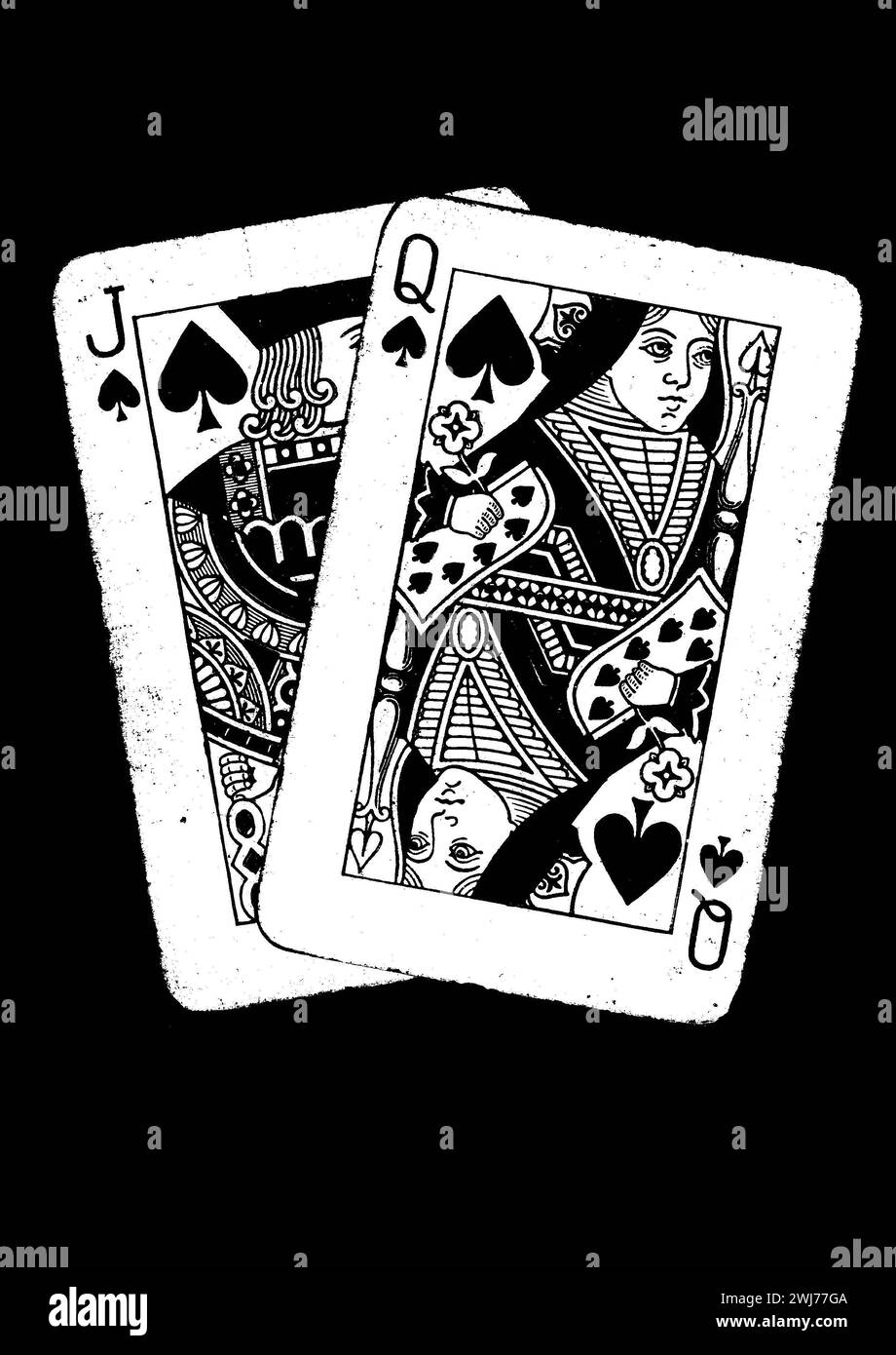 A pair of vintage playing cards in black and white isolated on a black ...