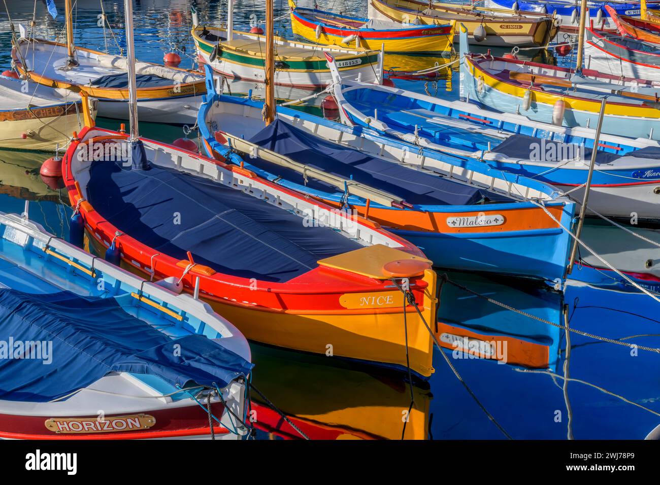 Rows of colourful rowing boats called "pointus". Used as fishing boats ...