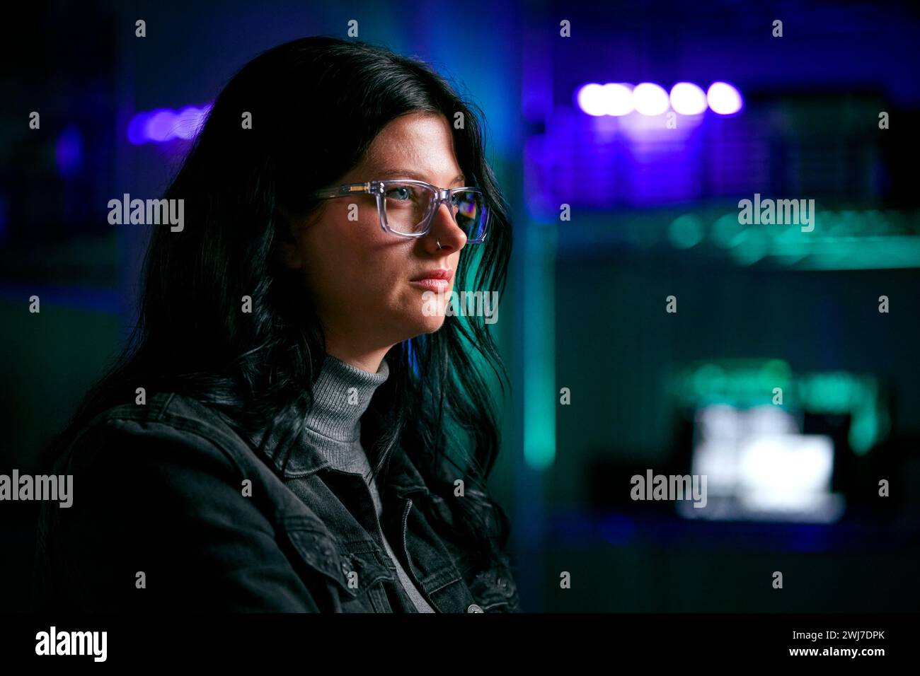 Close Up Of Female Computer Hacker Sitting In Front Of Screens ...