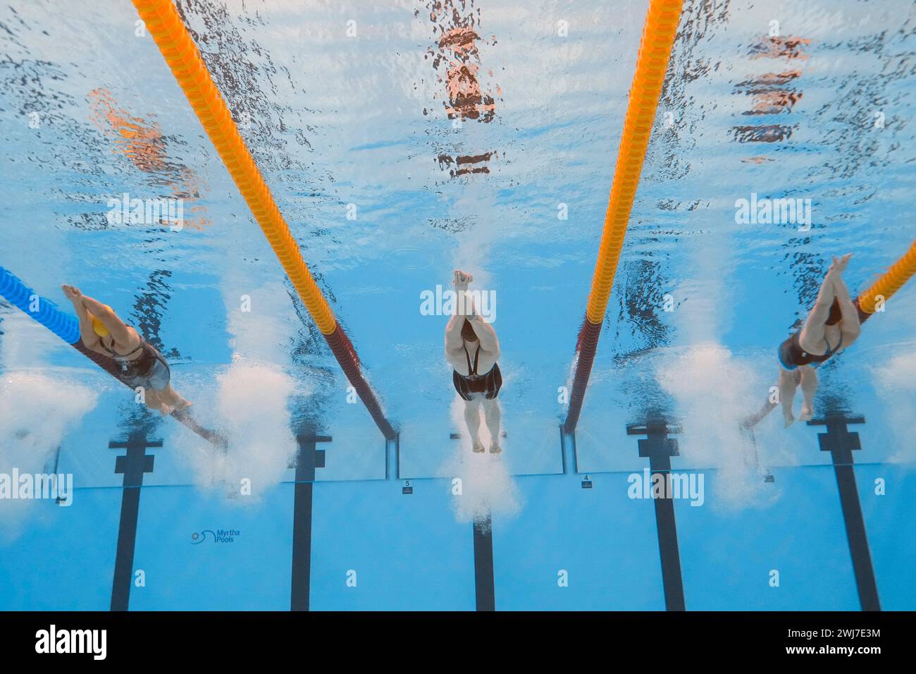 Claire Curzan of the United States, right, Ingrid Wilm of Canada ...
