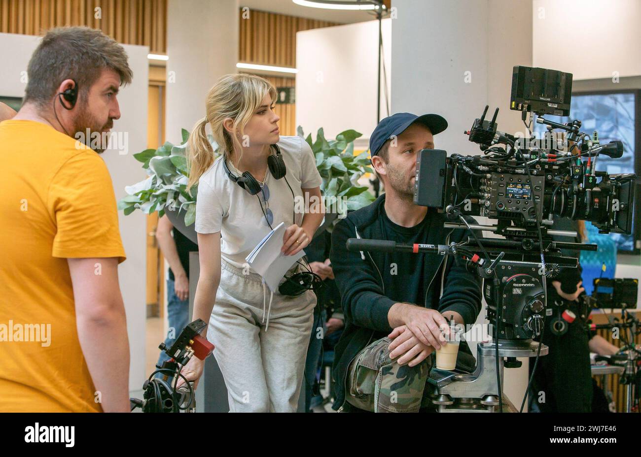UPGRADED, director Carlson Young (center), on set, 2024. ph: Paul ...