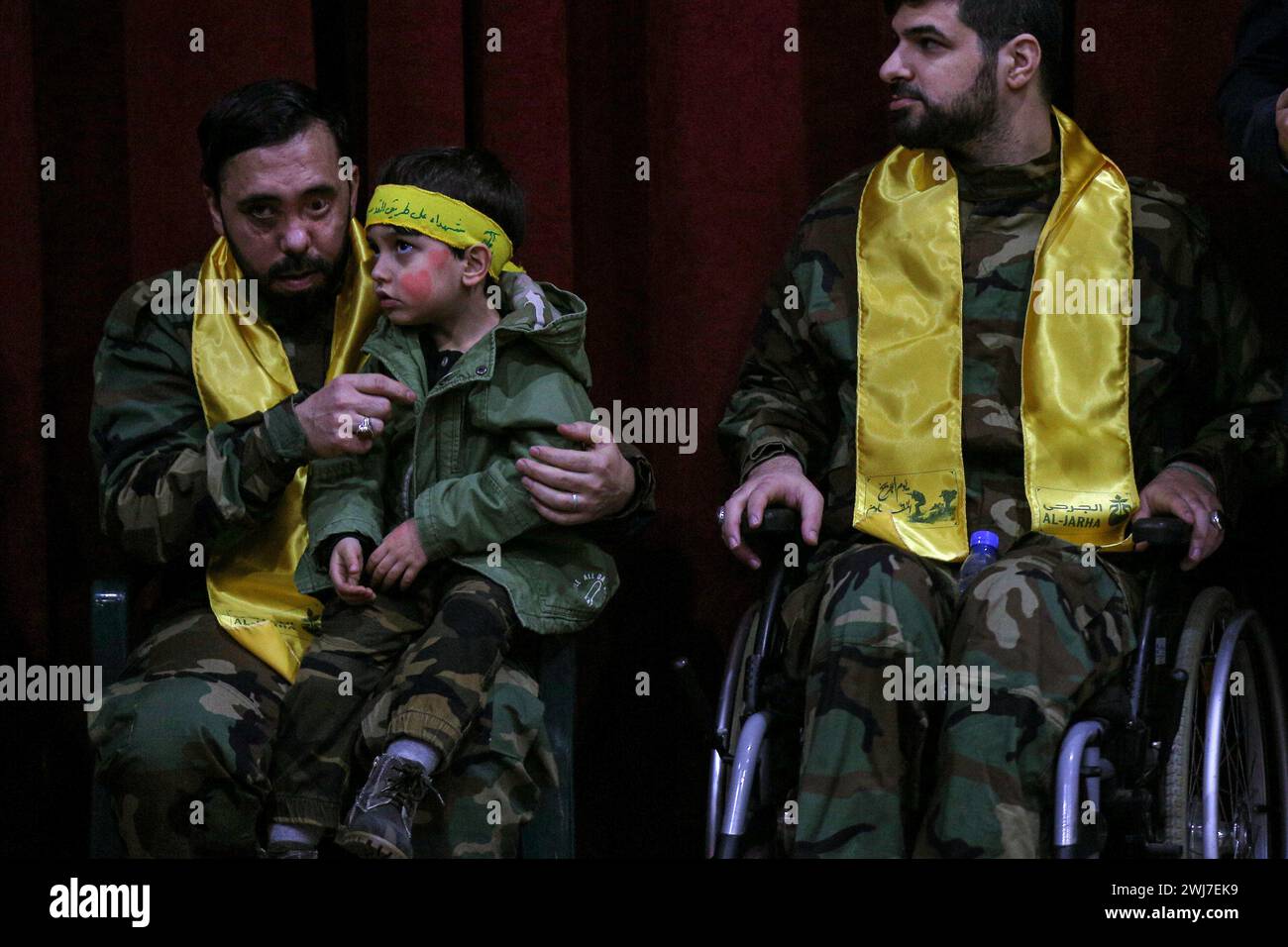Beirut, Lebanon. 13th Feb, 2024. Injured Hezbollah fighters listen to a ...